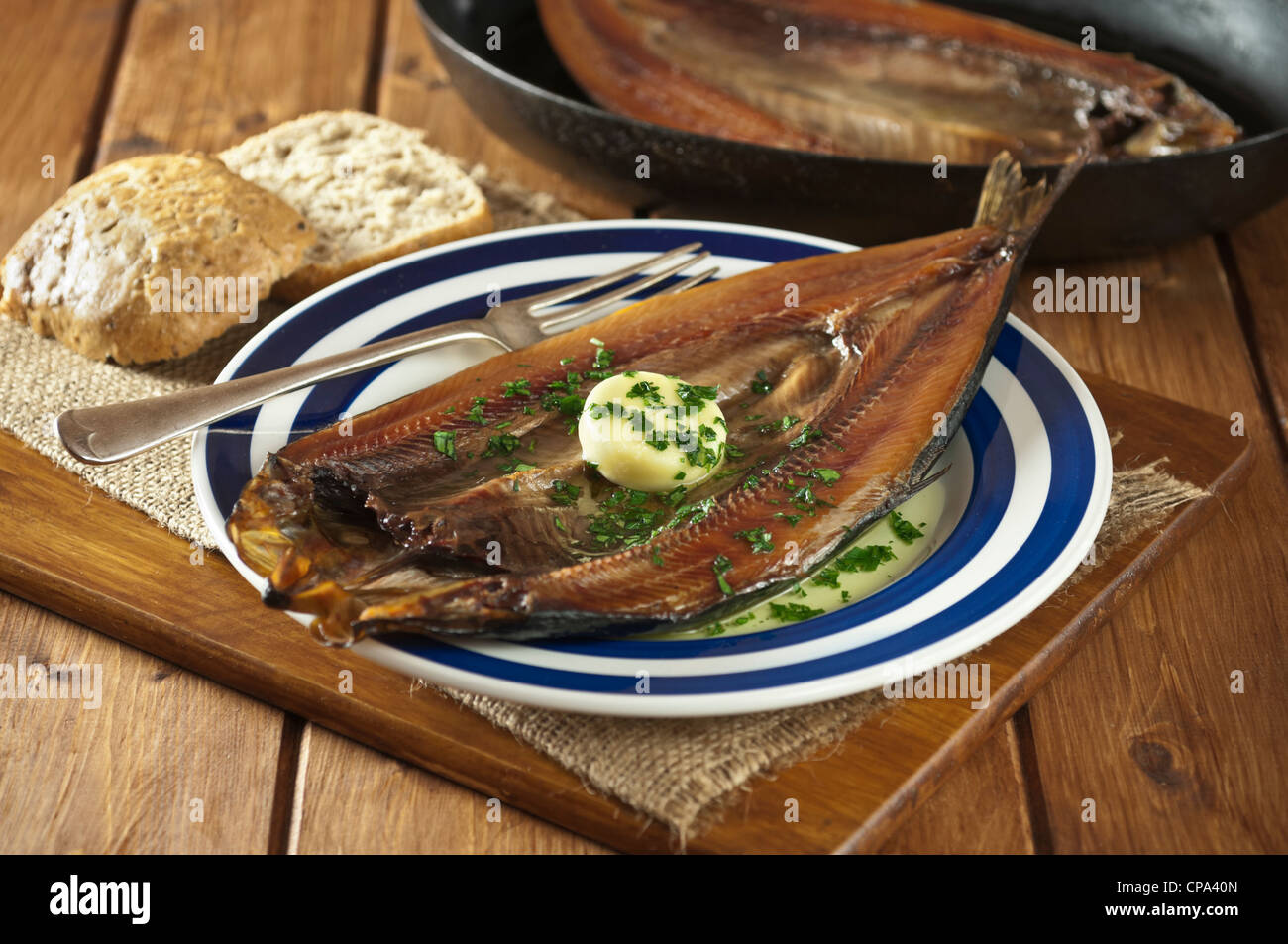 Kippers smoked herrings on plate Stock Photo - Alamy