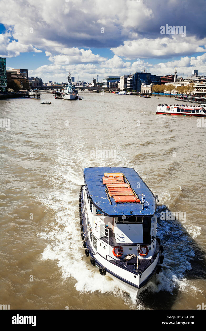 A small boat sailing down the river Thames, London, England Stock Photo - Alamy
