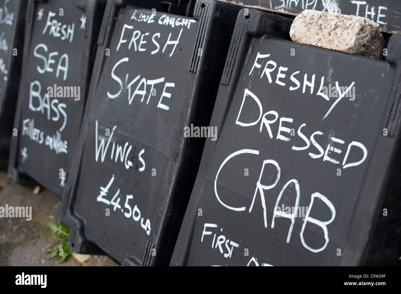 Fish for sale signs on blackboards at Aldeburgh Suffolk UK Stock Photo ...