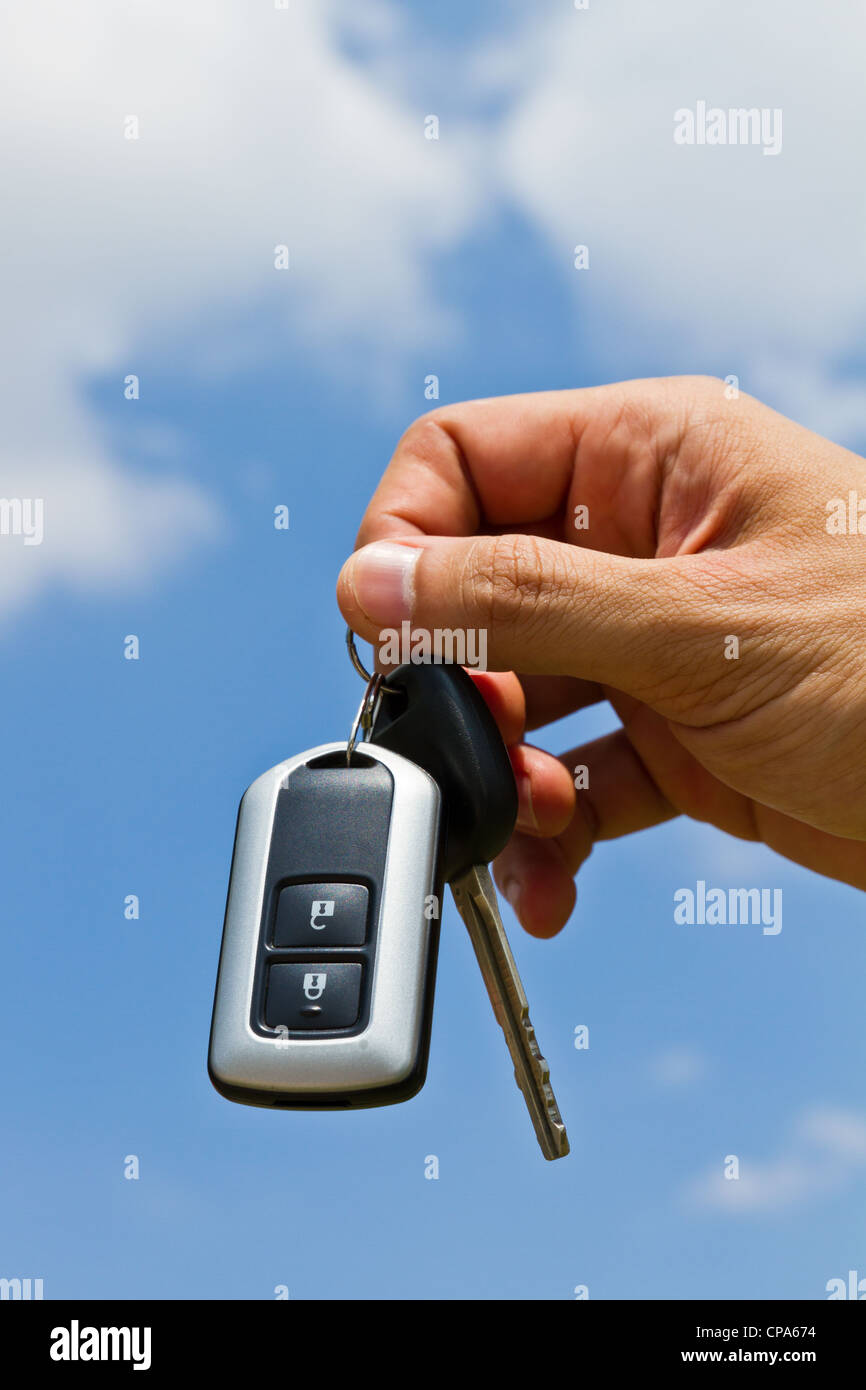Hand holding car key Stock Photo - Alamy