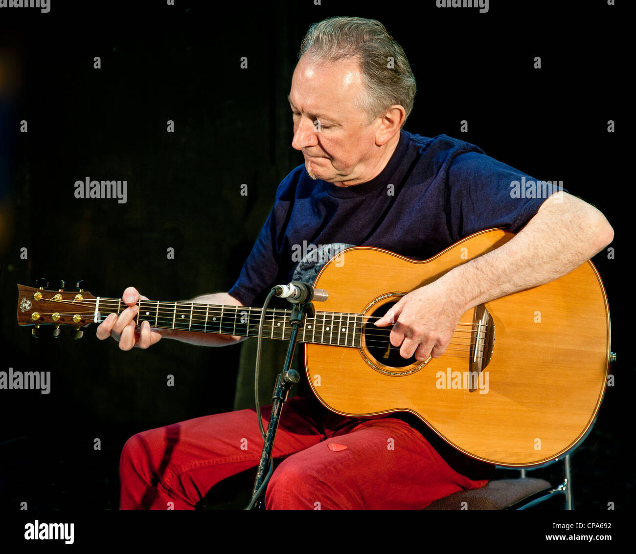 Donal Lunny playing guitar Stock Photo - Alamy