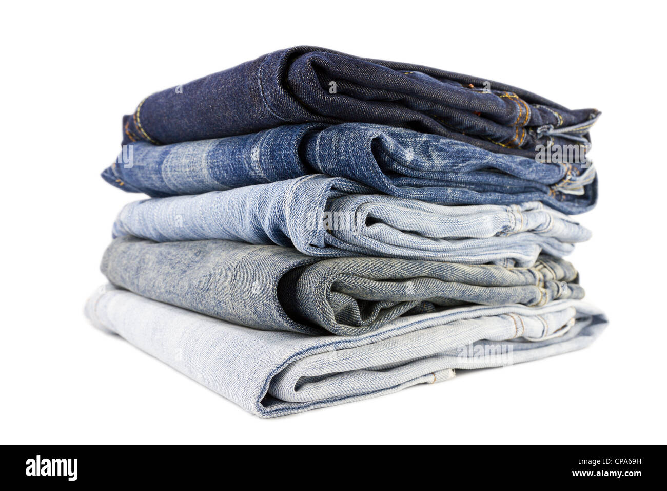 Stack of blue jeans on white background Stock Photo - Alamy