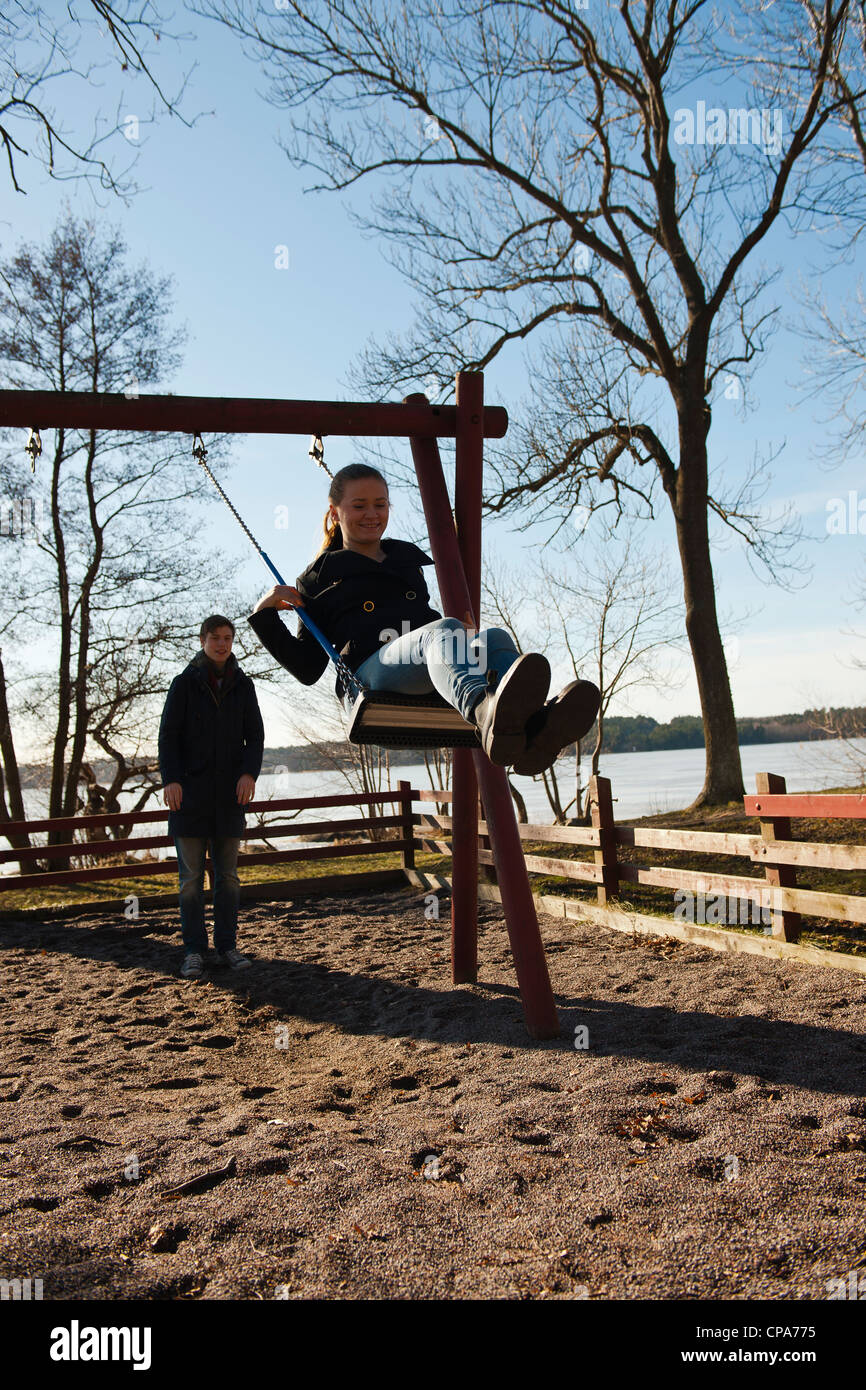 Girl in a swing Stock Photo - Alamy