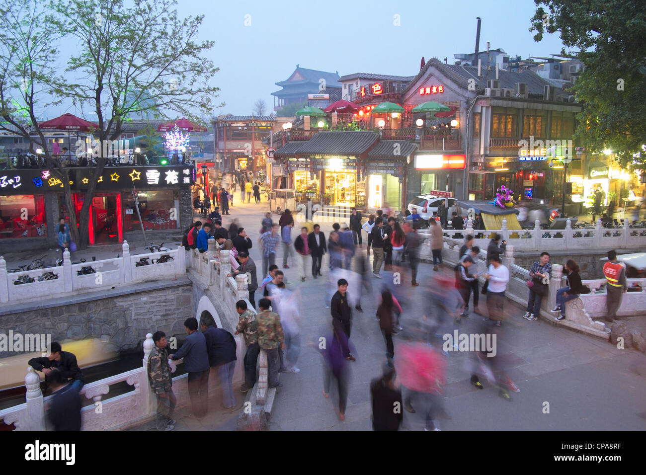 Busy street on historic bridge beside popular tourist location at ...