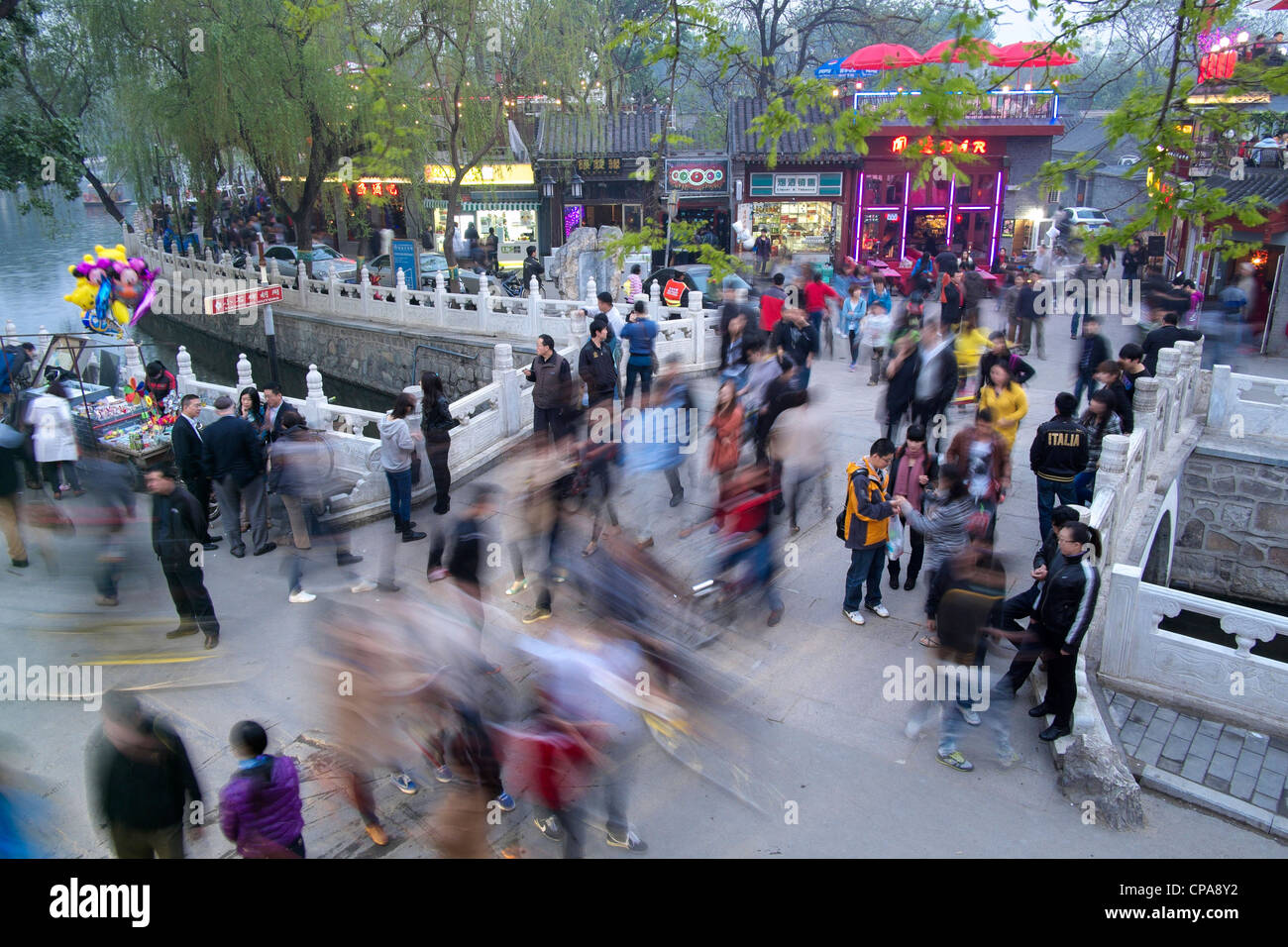 Busy street on historic bridge beside popular tourist location at ...