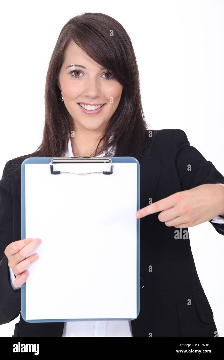 Young secretary pointing a notepad on white background Stock Photo - Alamy