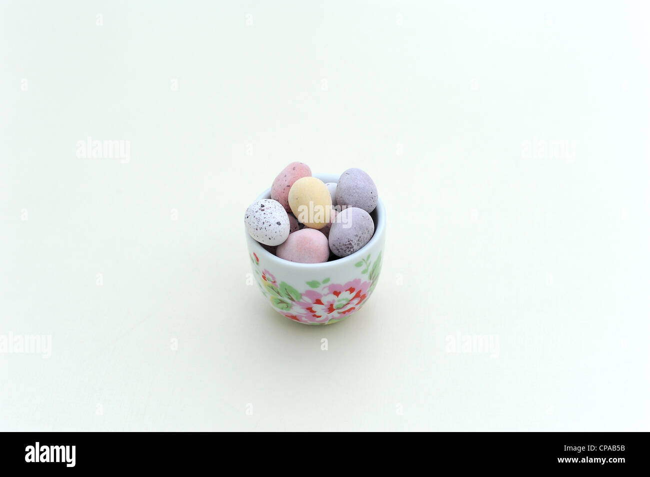 Cadburys Mini Eggs in a Flowery Egg Cup Stock Photo - Alamy