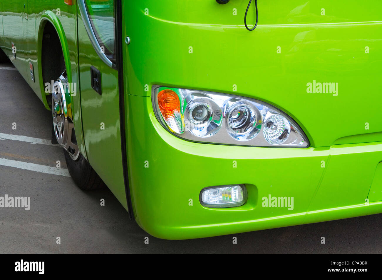 Green bus headlight and wheel Stock Photo - Alamy