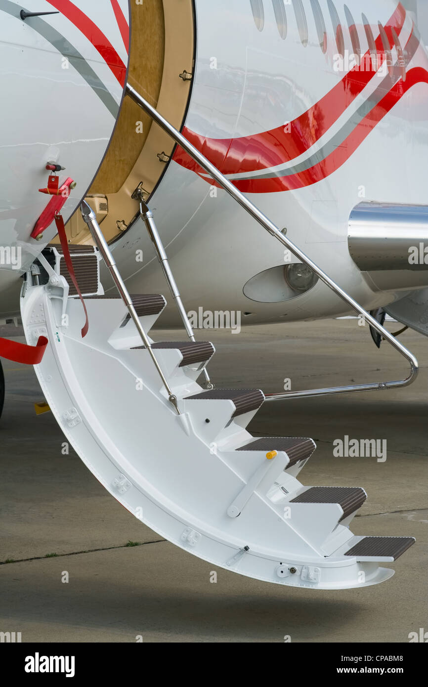 Civil airplane low air-stairs Stock Photo - Alamy