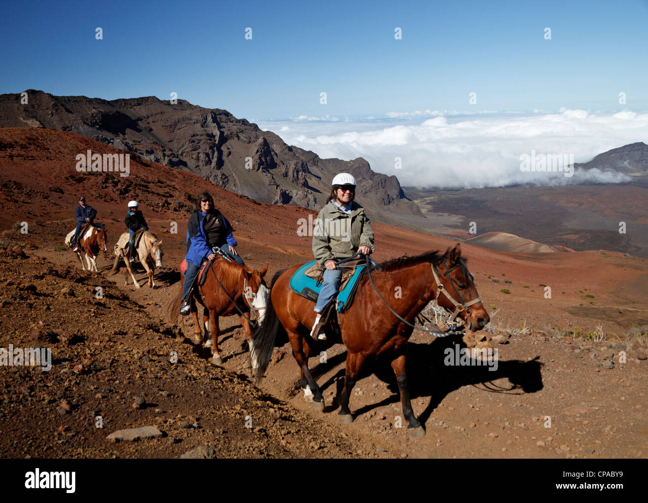 Horseback riders on the Sliding Sands Trail at Haleakala National Park ...