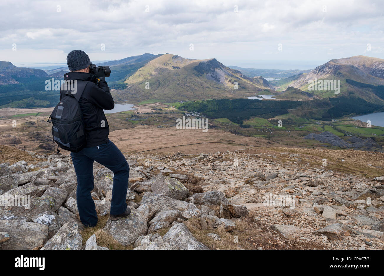 Photographer taking landscape photos from Mount Snowdon in the ...