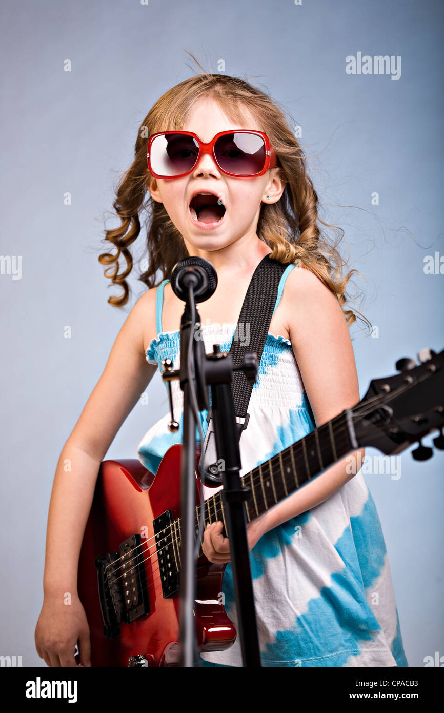 portrait of young girl with a guitar on the stage Stock Photo - Alamy