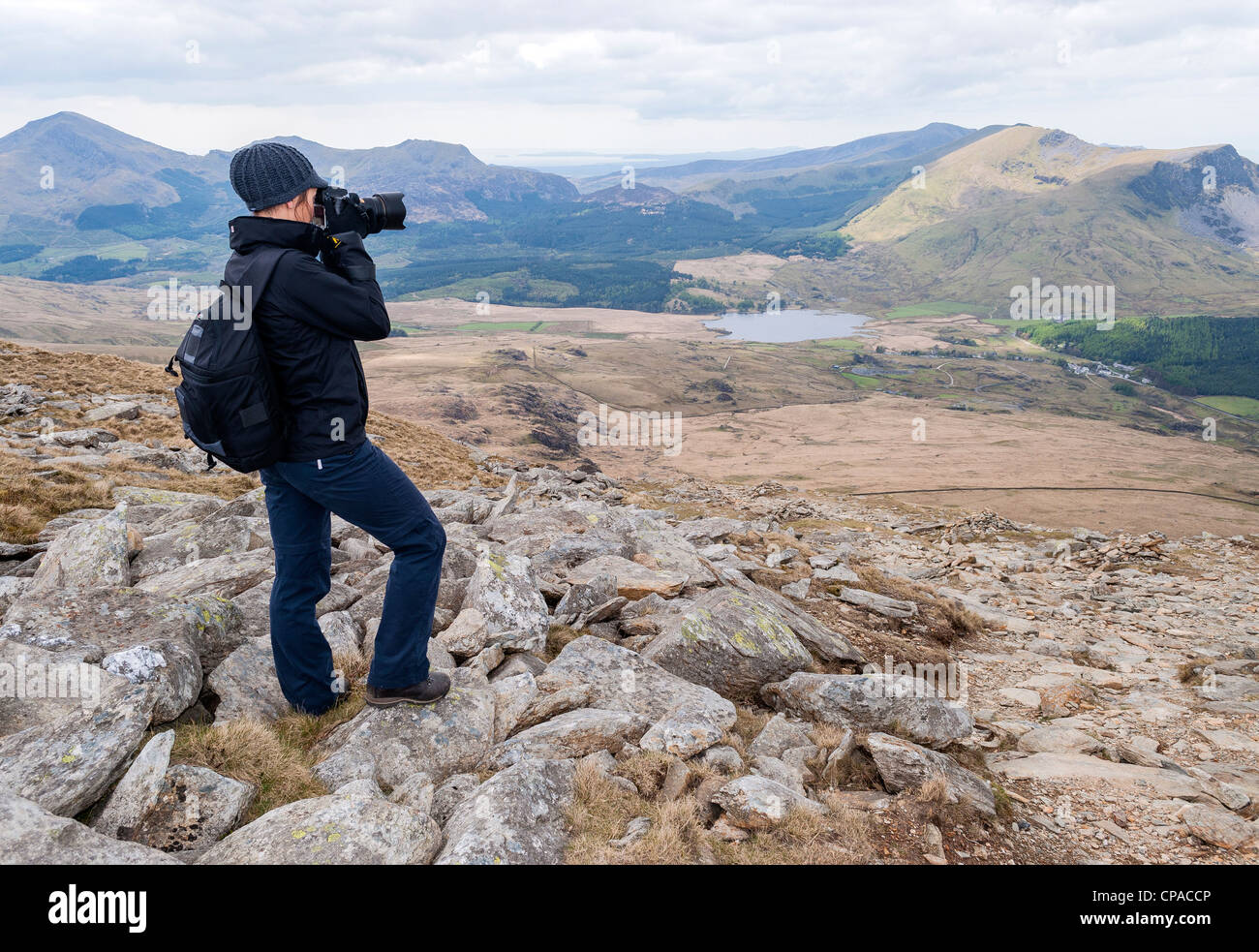 Photographer taking landscape photos from Mount Snowdon in the ...