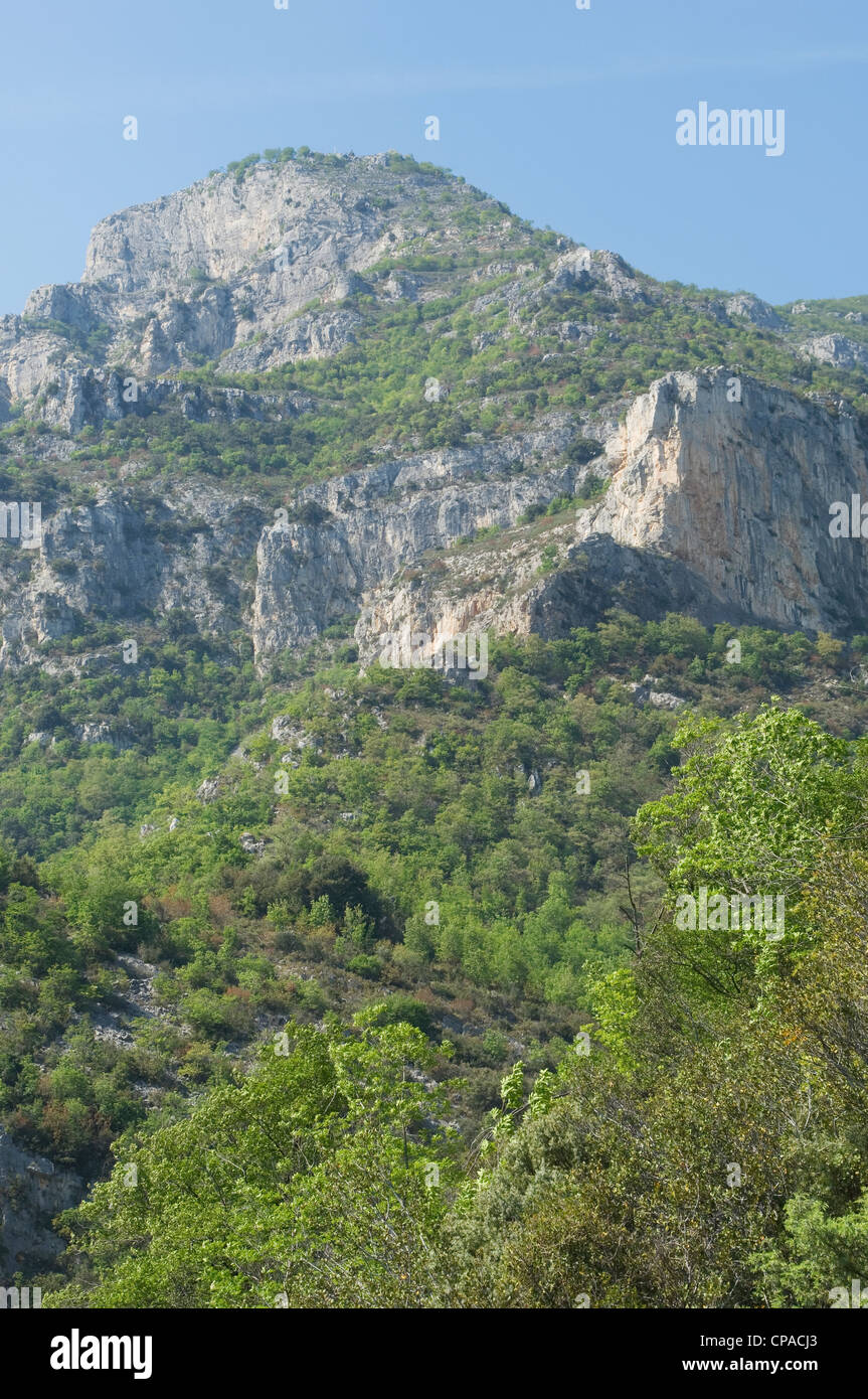 Limestone cliffs and woodland around Grotte di Toirano, Liguria, Italy ...