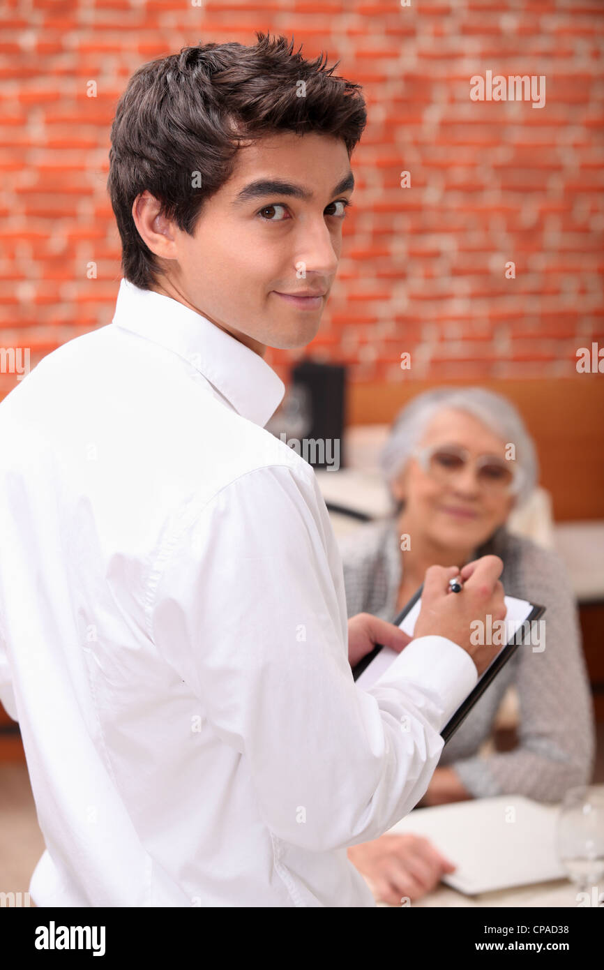 Waiter taking an order in a restaurant Stock Photo - Alamy
