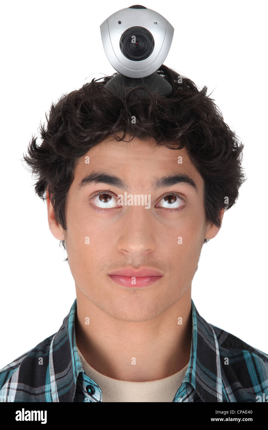 Teenager with a webcam on his head Stock Photo - Alamy