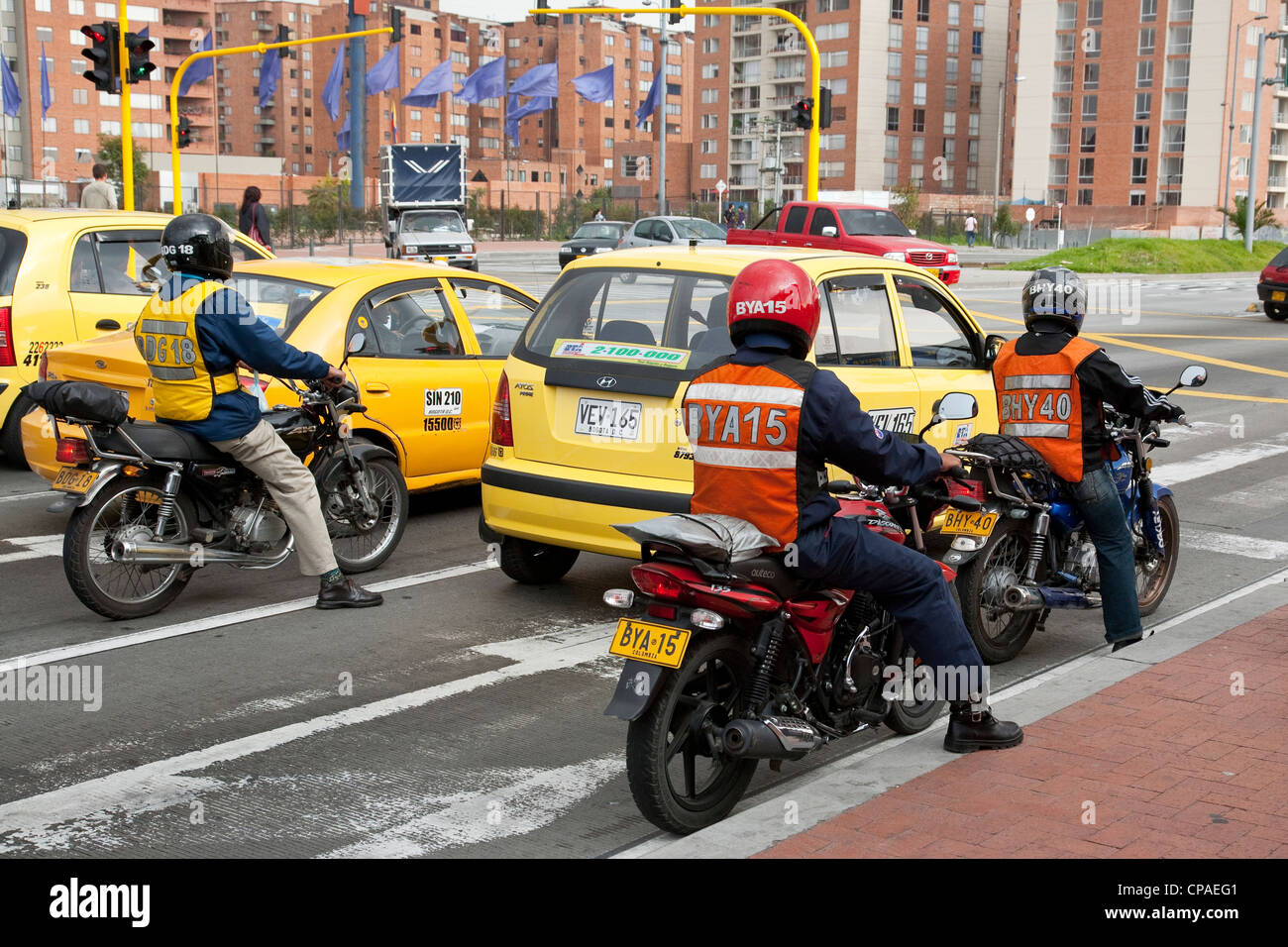 All bike riders in Colombia have to wear a vest with a registration ...