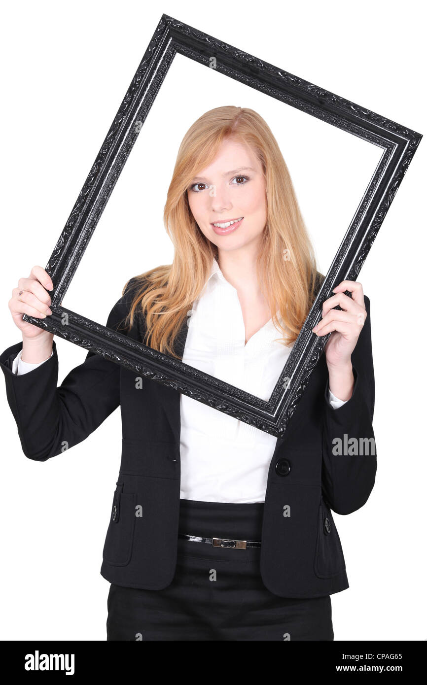 beautiful girl looking through a picture frame Stock Photo - Alamy