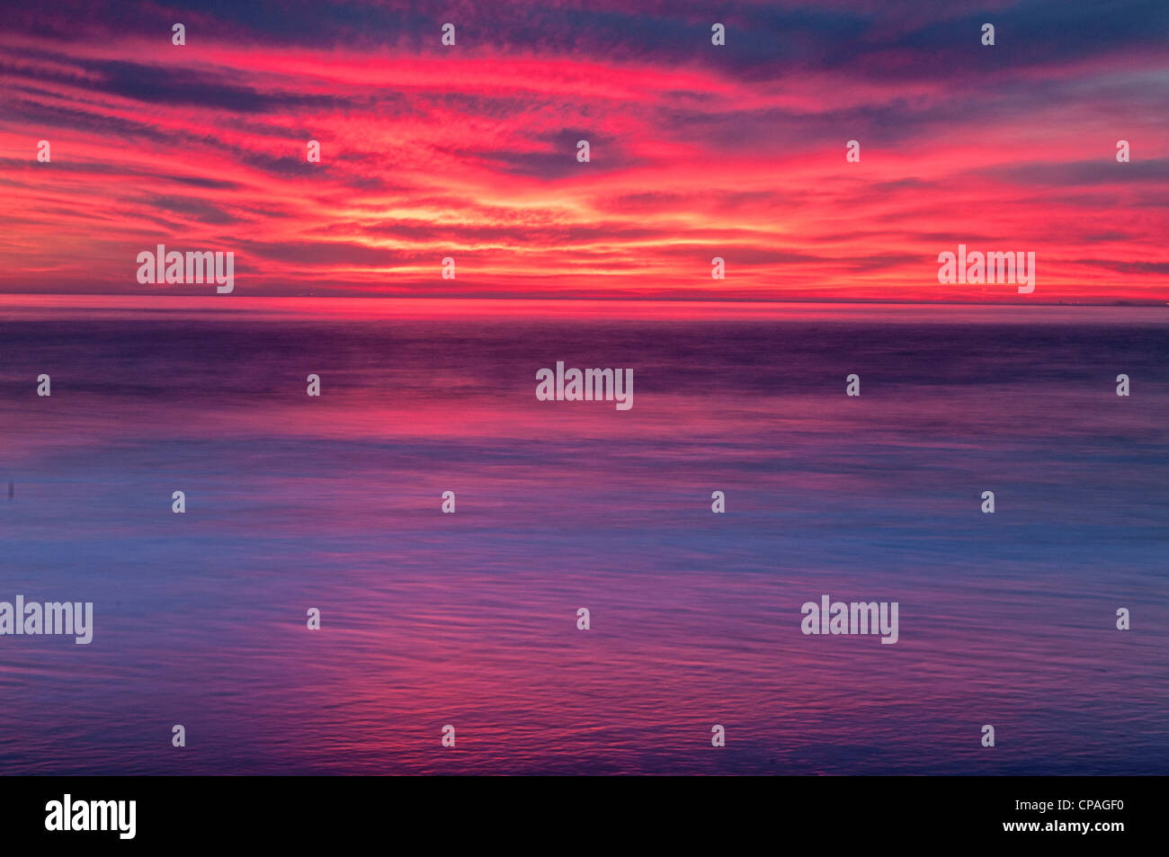 USA, New Jersey, Cape May. Multi-colored sunrise on ocean shore Stock ...
