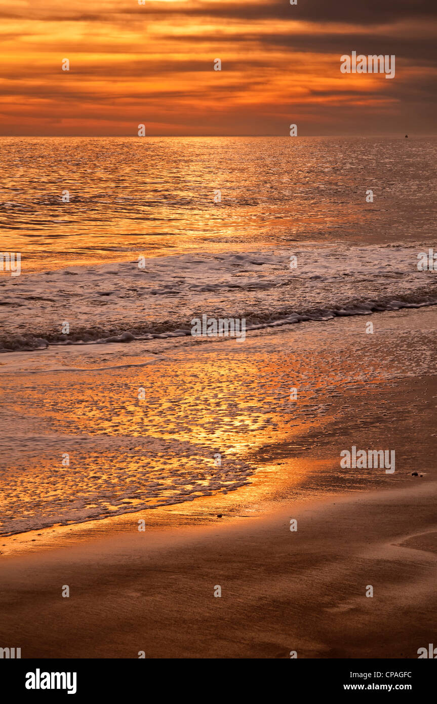 USA, New Jersey, Cape May. Sunset reflections off clouds and ocean ...