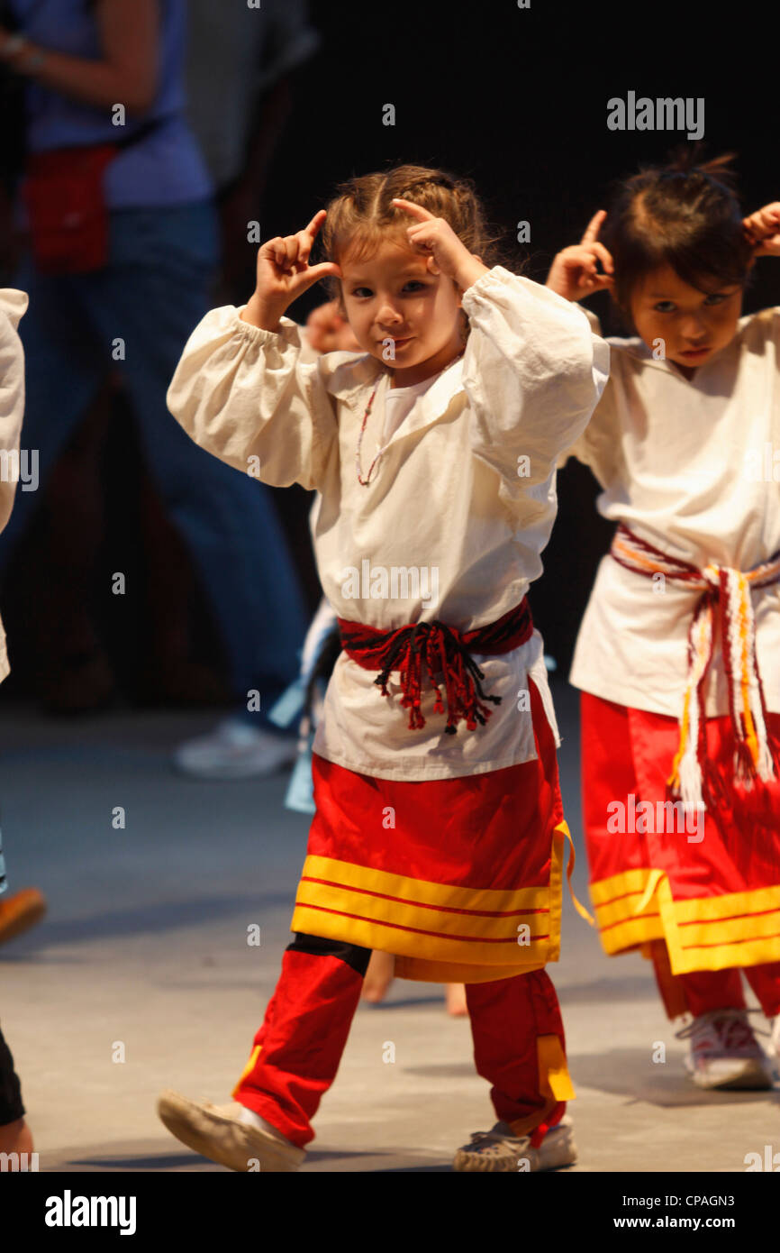 USA, North Carolina, Cherokee. Young girl performing an Ant Dance ...