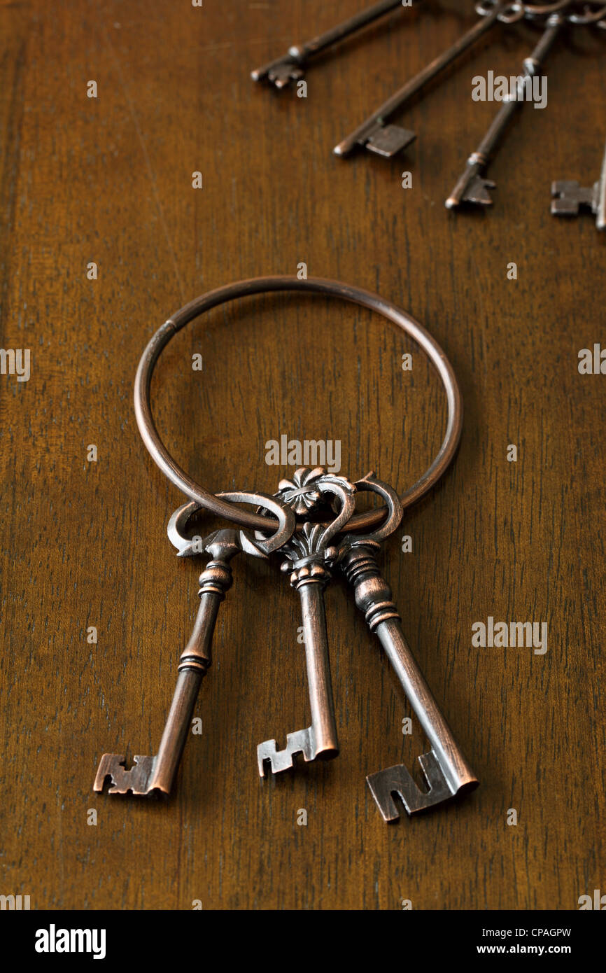 Old key on wooden background Stock Photo - Alamy