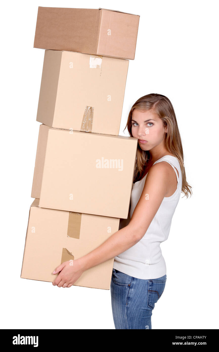 Young woman carrying a pile of boxes Stock Photo - Alamy