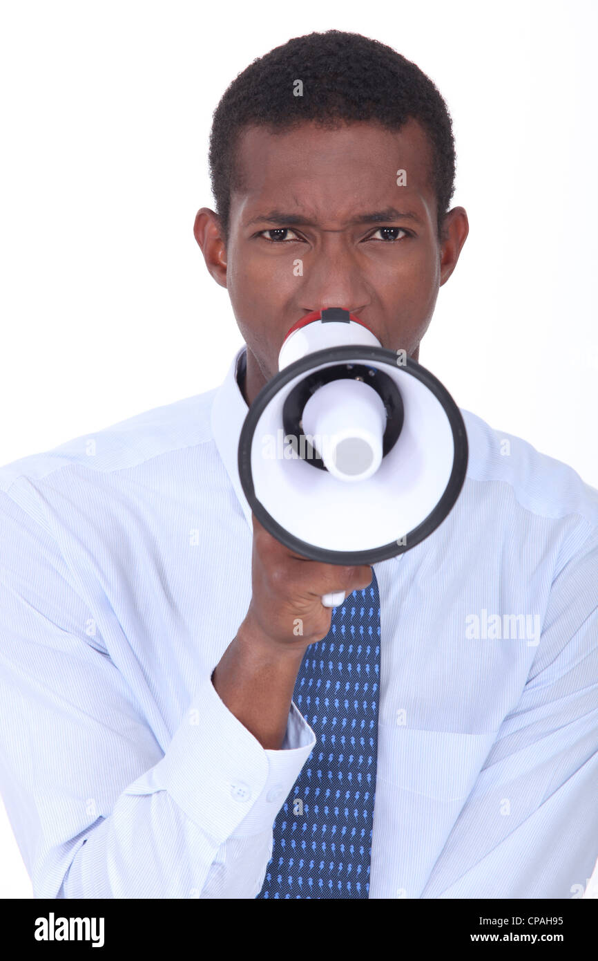 Office worker shouting into megaphone Stock Photo - Alamy