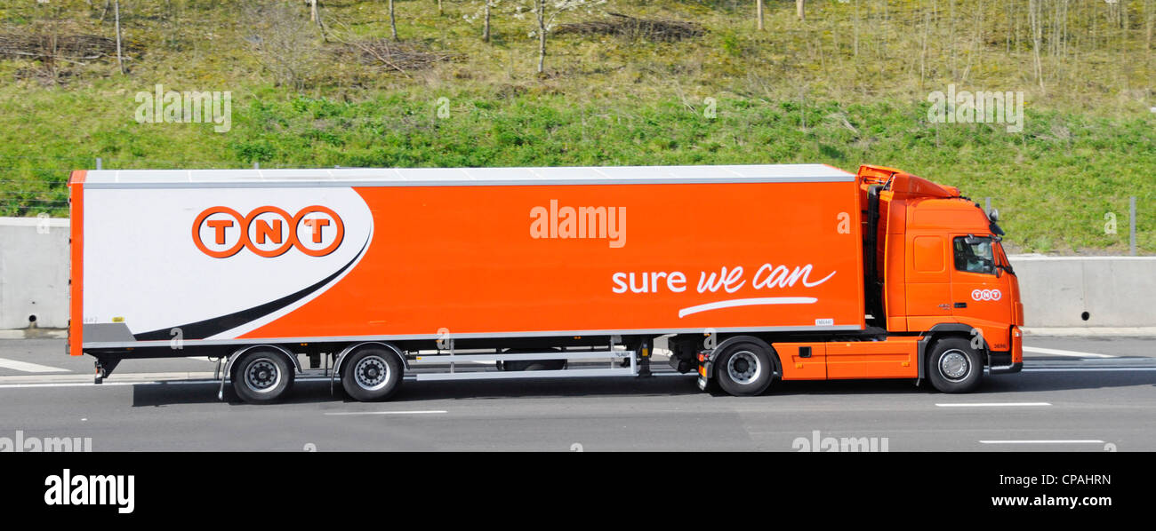 TNT hgv parcel delivery lorry truck and articulated trailer driving ...