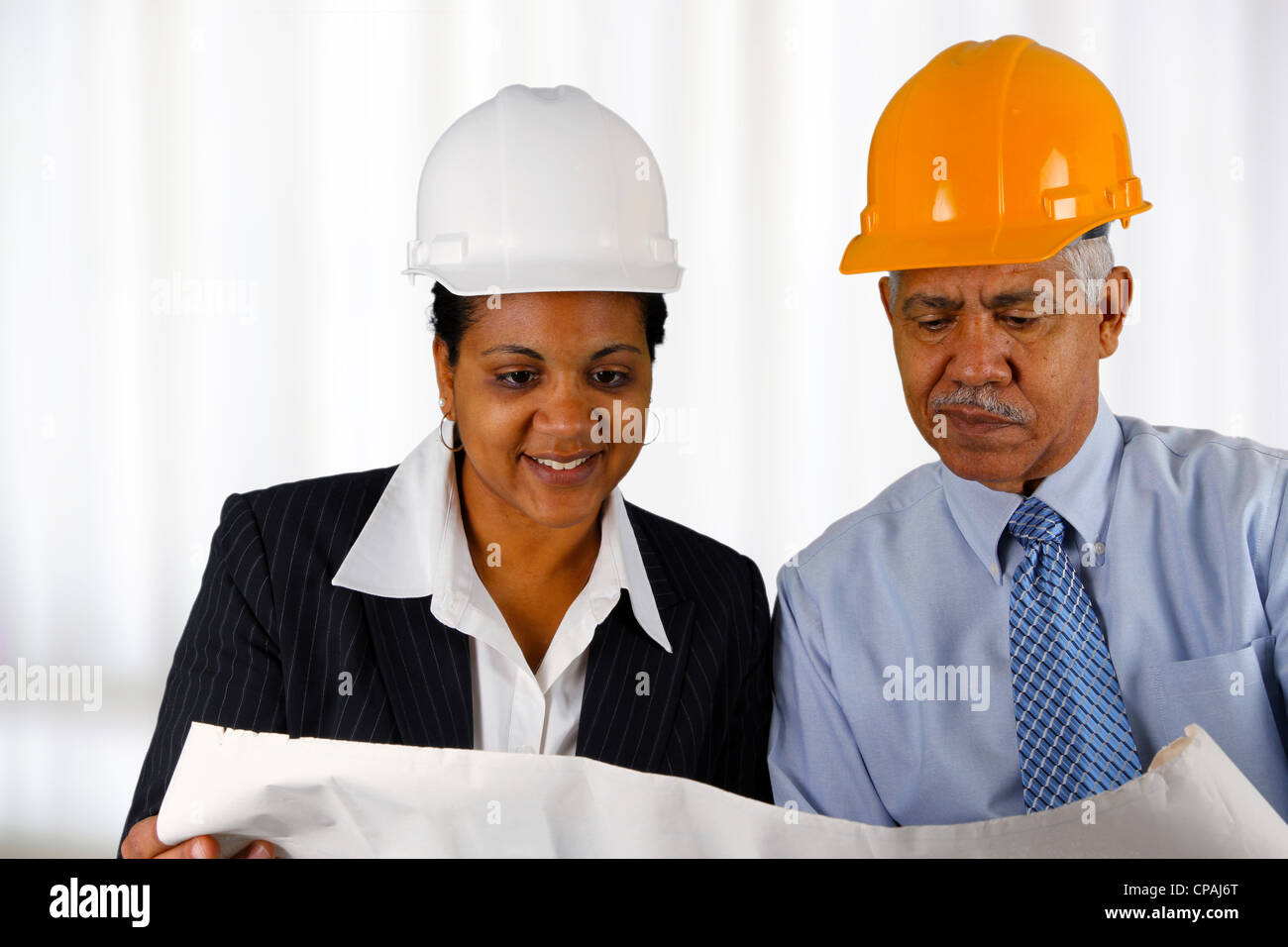 Construction workers working on a job together Stock Photo - Alamy
