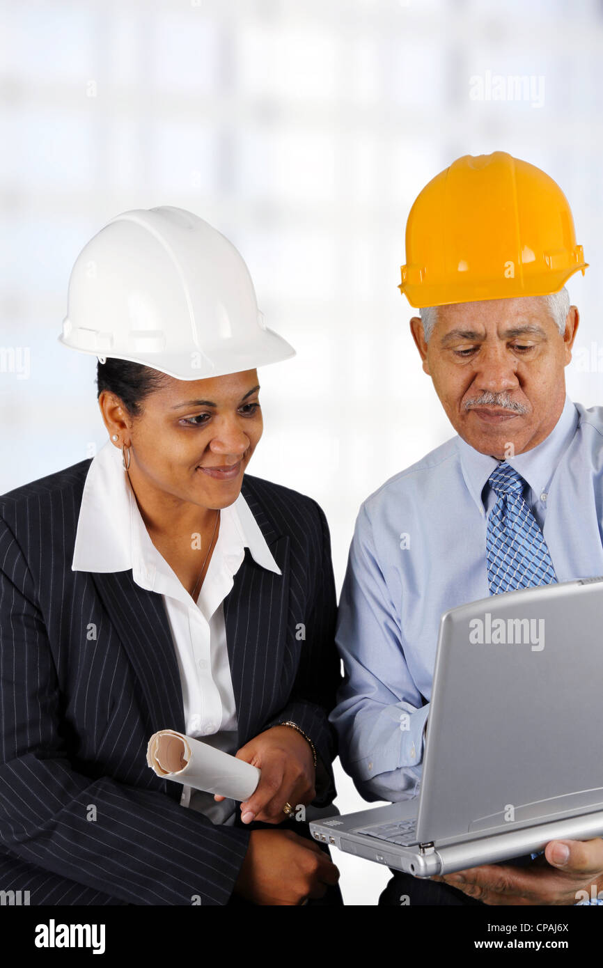 Construction workers working on a job together Stock Photo - Alamy