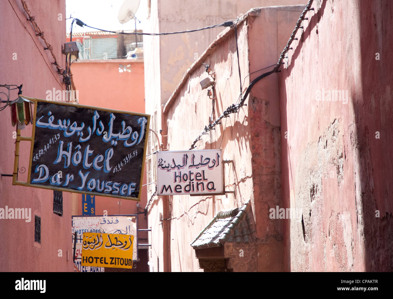 hotel signs inside the Medina Marrakesh morocco Stock Photo - Alamy