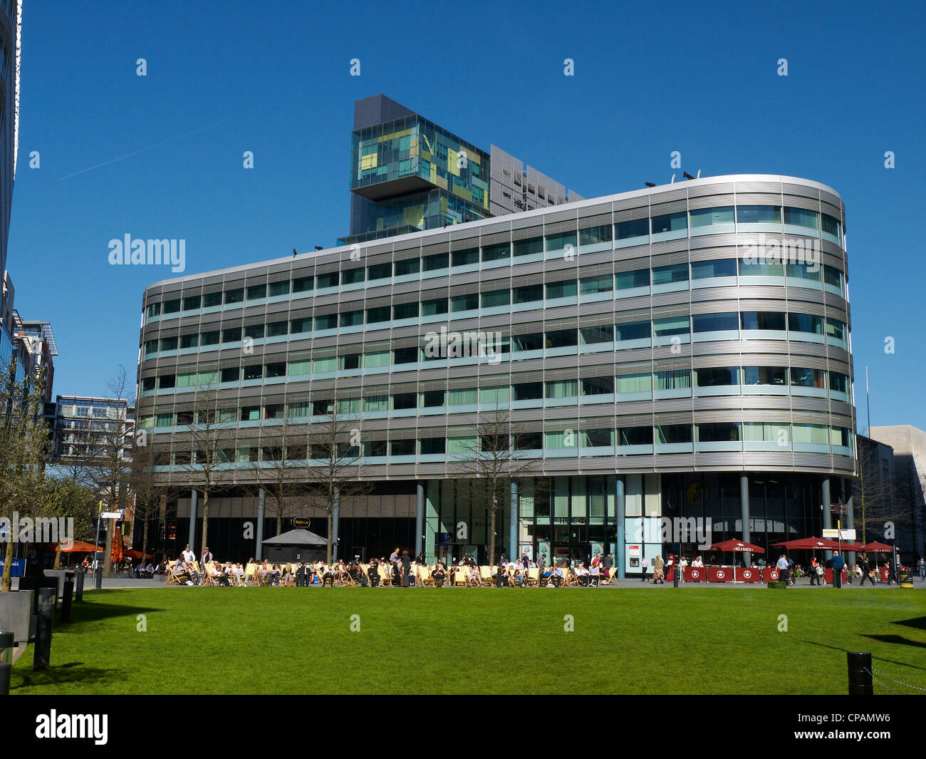 Office workers having lunch break in Hardman Square, Spinningfields ...