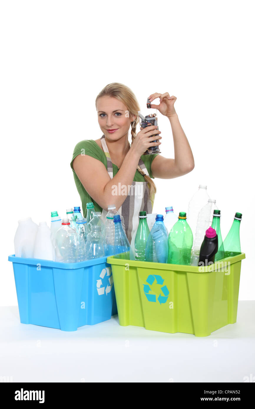 Woman recycling old plastic bottles Stock Photo - Alamy