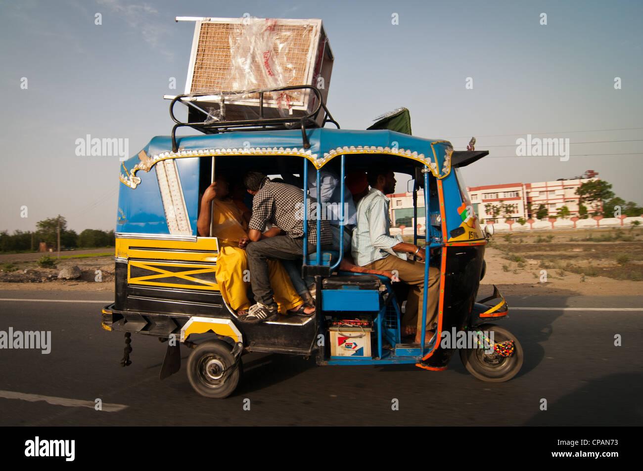 A loaded rickshaw travels on the highway outside of Amritsar, India ...