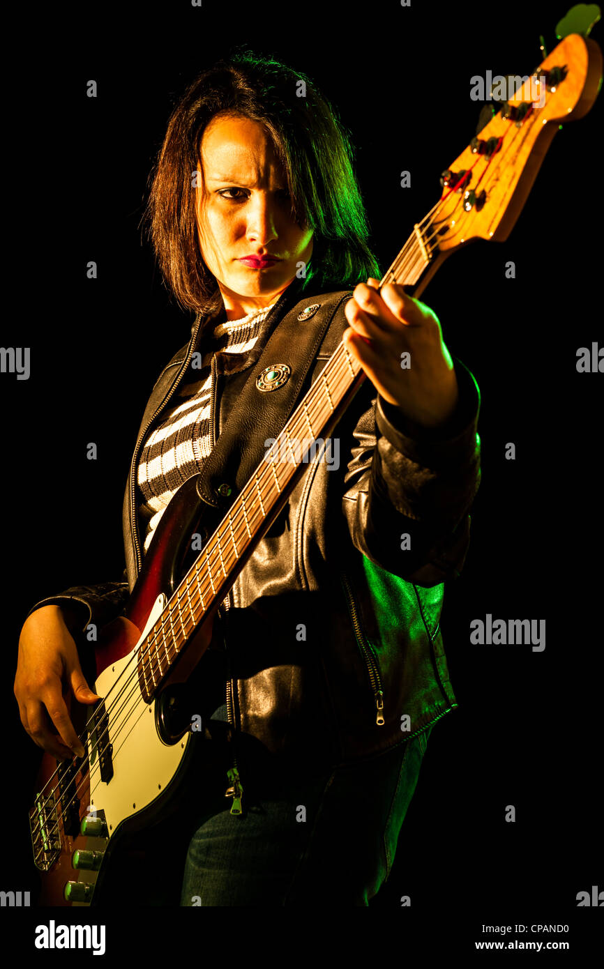 Rock Woman Playing Electric Bass Guitar Stock Photo - Alamy