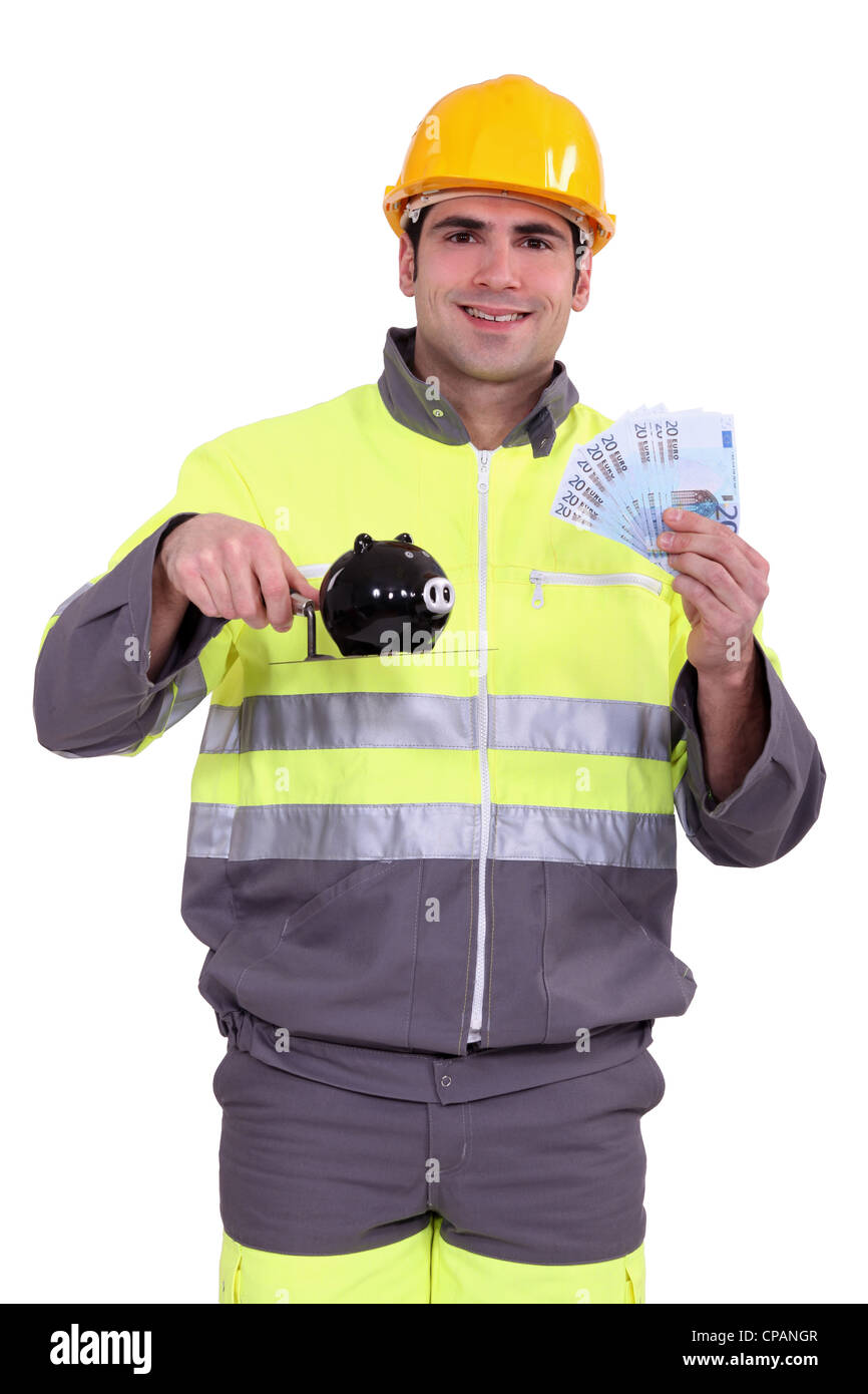 Hardworking man with his hard-earned savings Stock Photo - Alamy