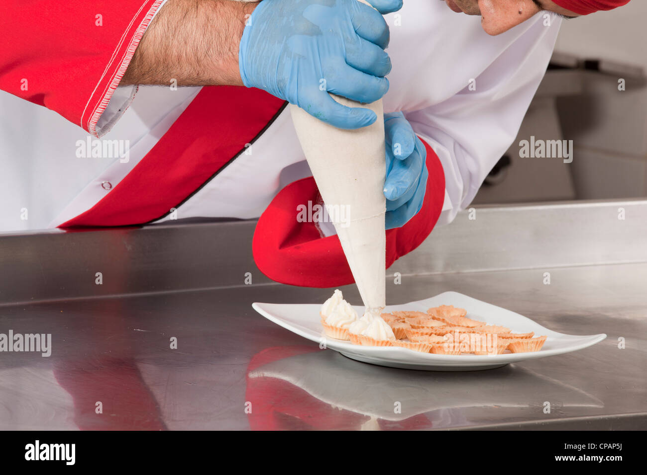 chef garnishing canapes Stock Photo - Alamy