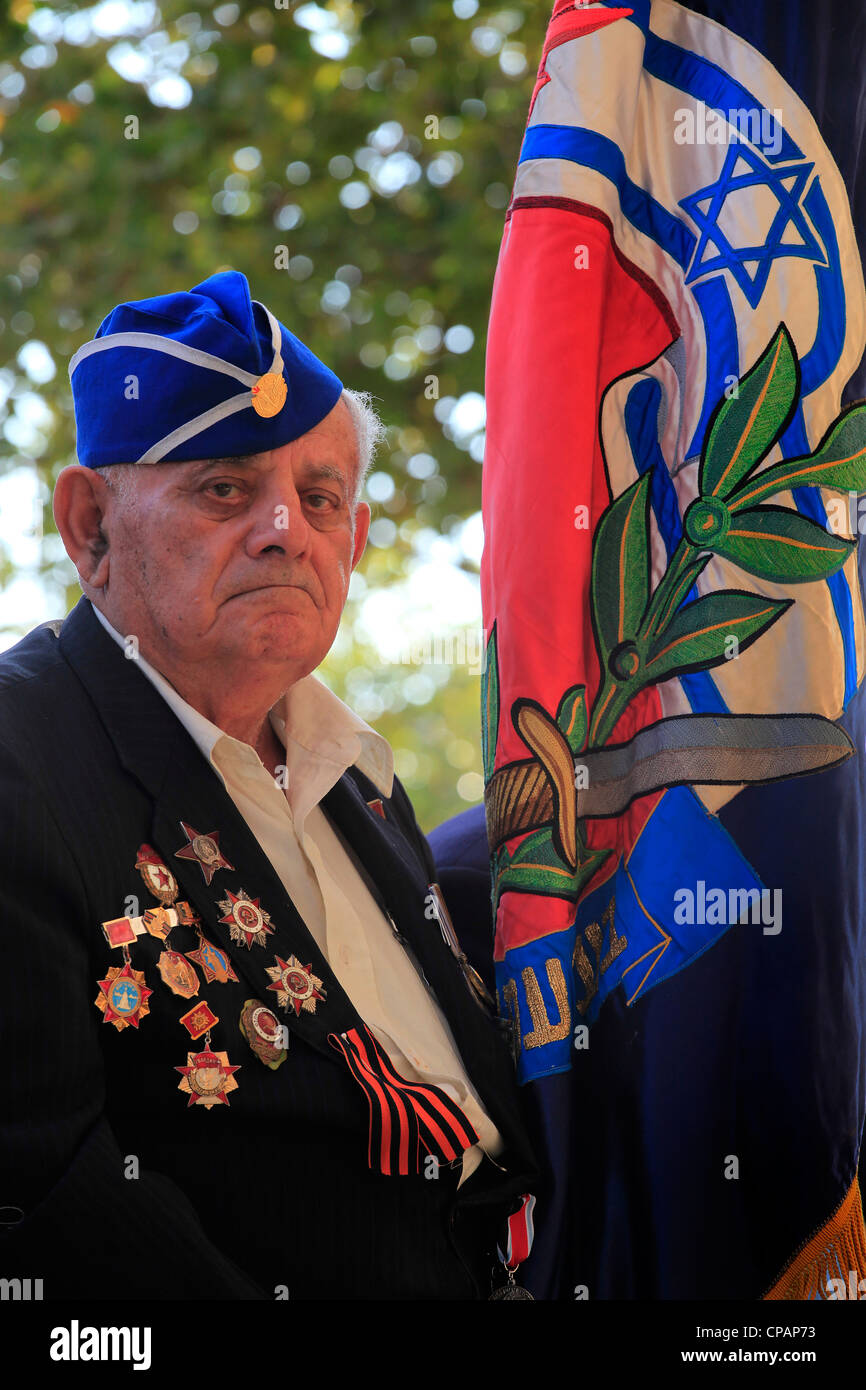 A soviet Jewish World War II veteran with medals pinned in his suit ...