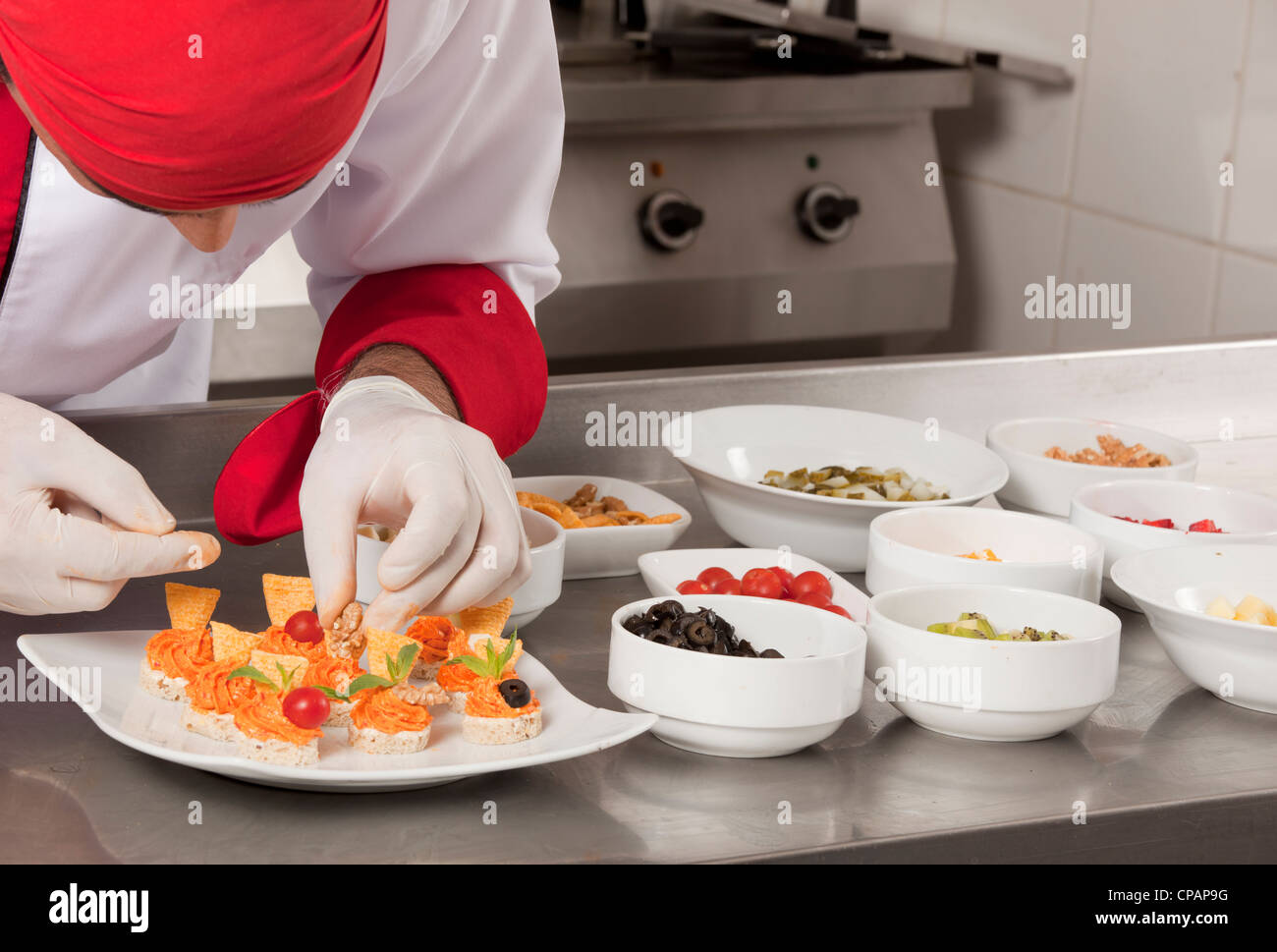 chef garnishing canapes Stock Photo - Alamy