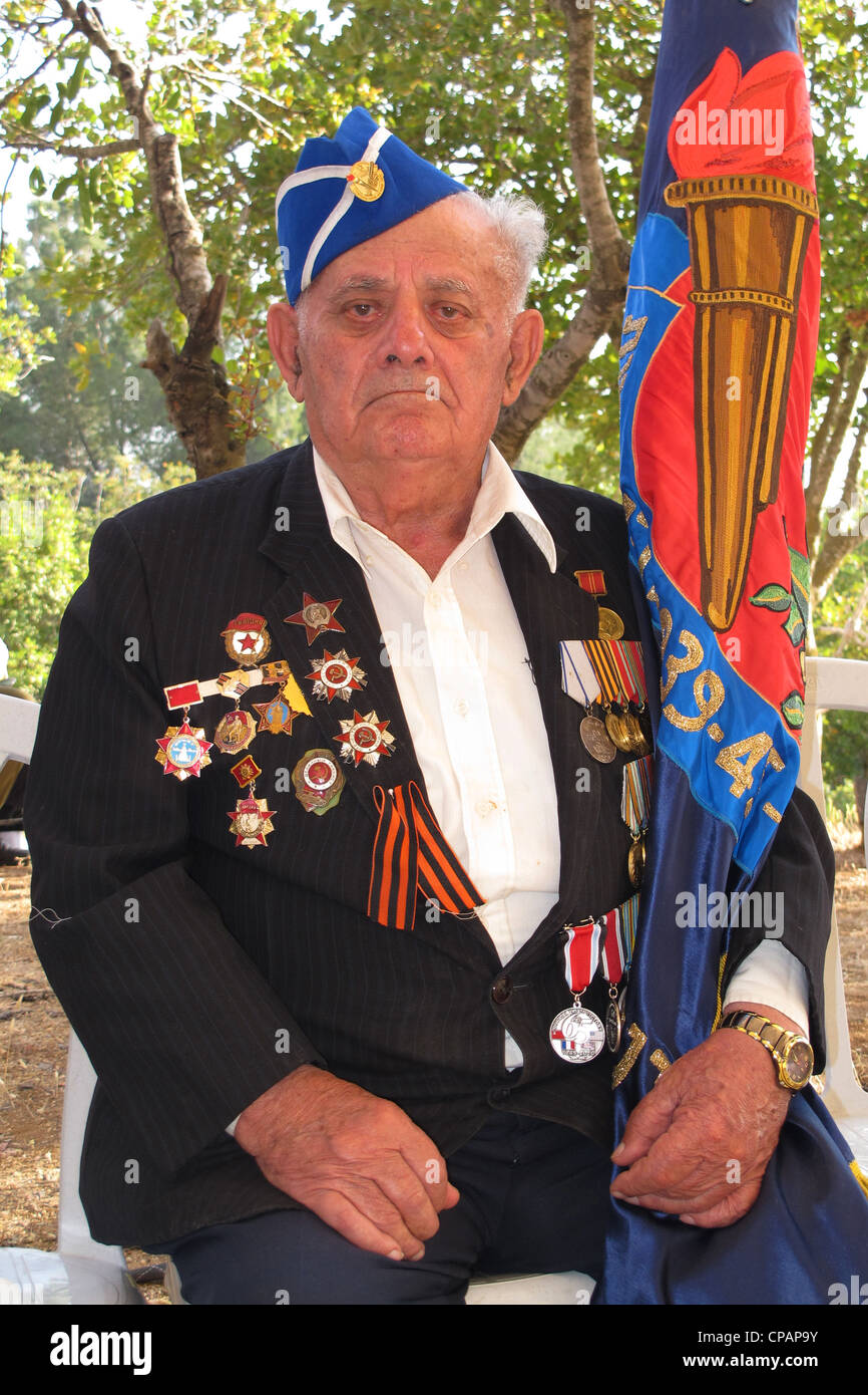 A soviet Jewish World War II veteran with medals pinned in his suit ...