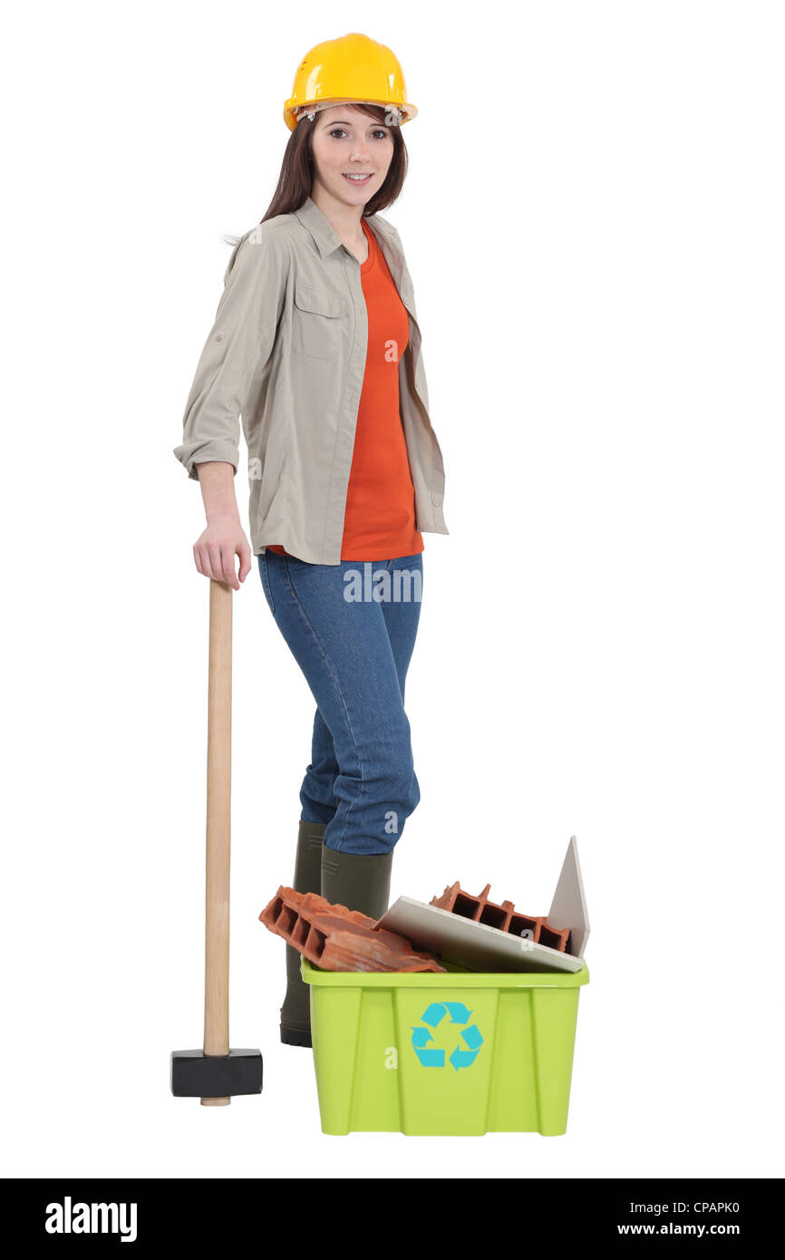 Female construction worker recycling old material Stock Photo - Alamy