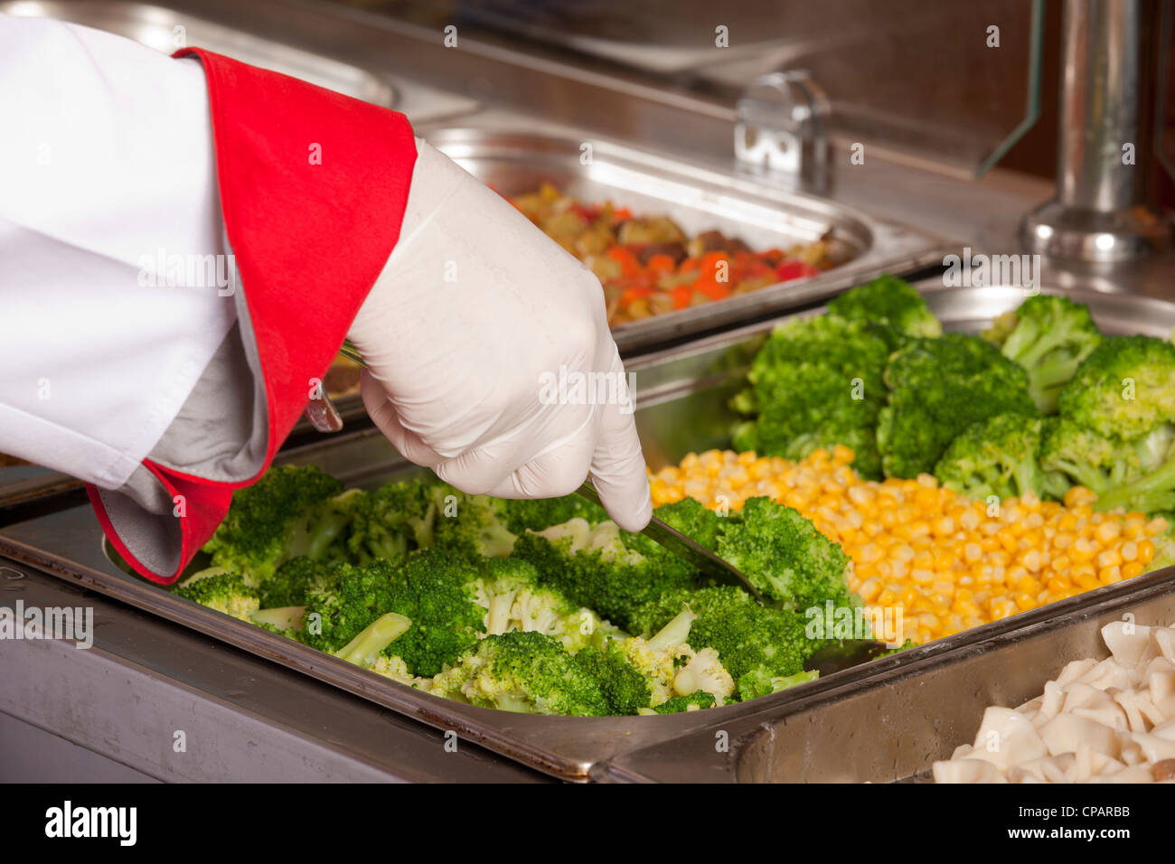 chef standing behind full lunch service station Stock Photo - Alamy