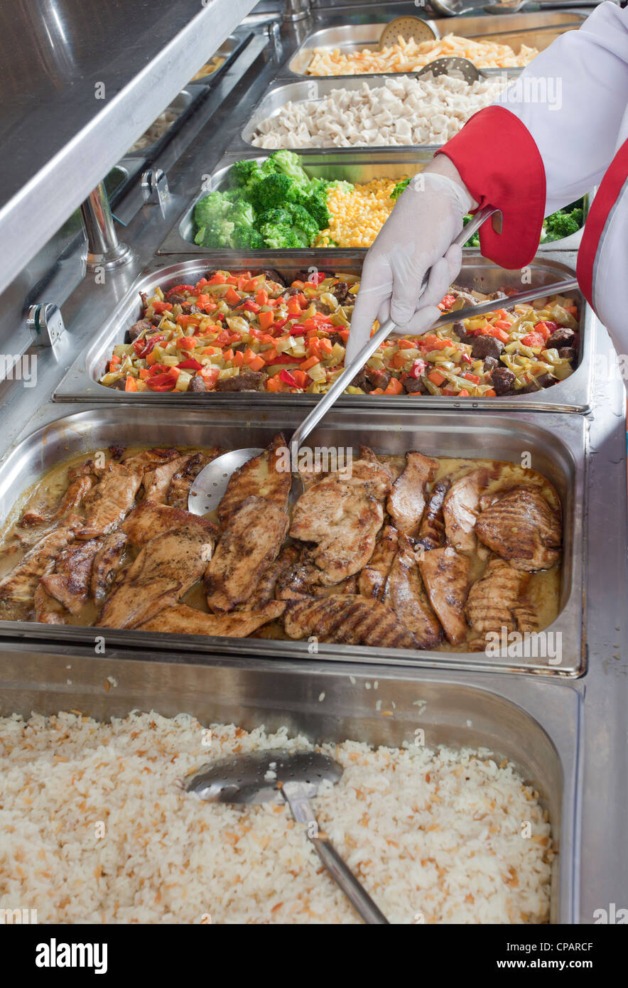chef standing behind full lunch service station Stock Photo - Alamy