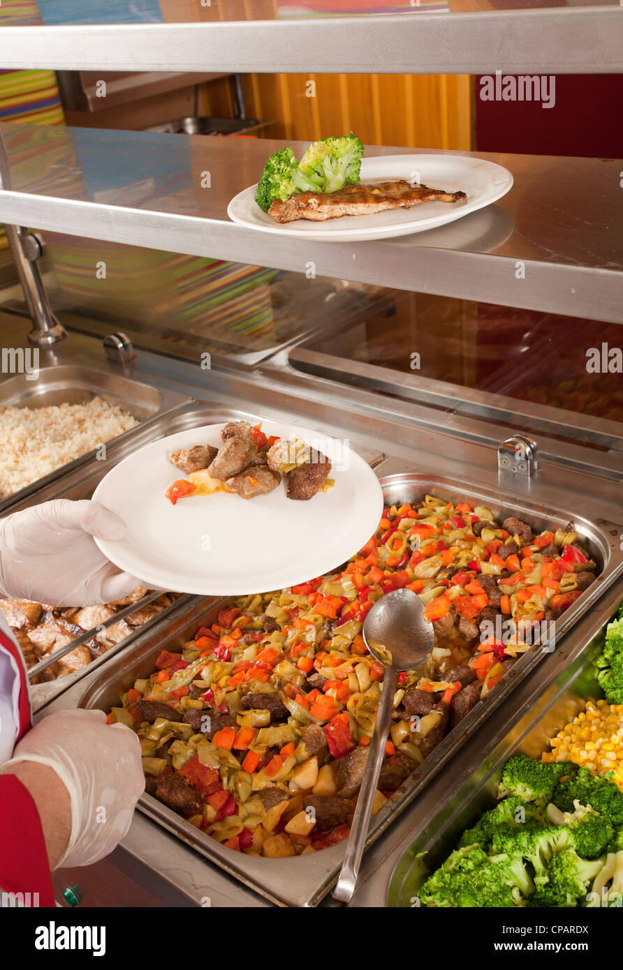 chef standing behind full lunch service station Stock Photo - Alamy
