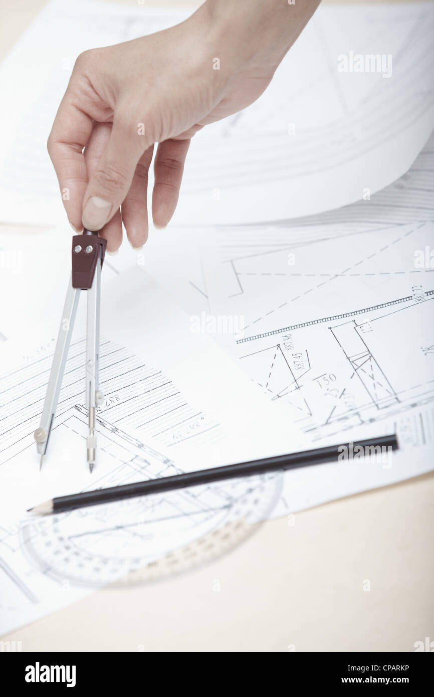 Hands of engineer working on a construction plan Stock Photo - Alamy