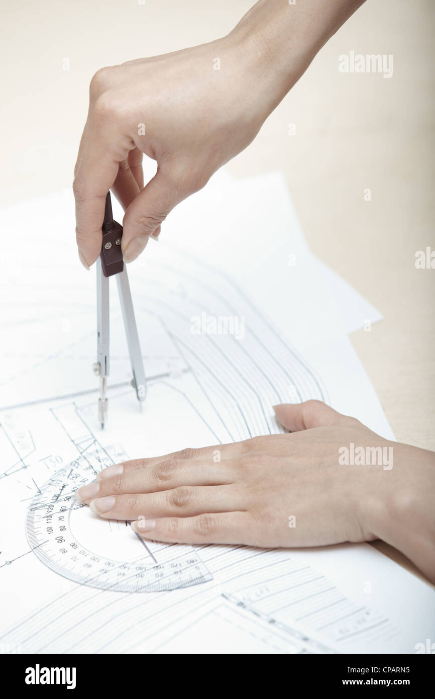 Hands of engineer working on a construction plan Stock Photo - Alamy