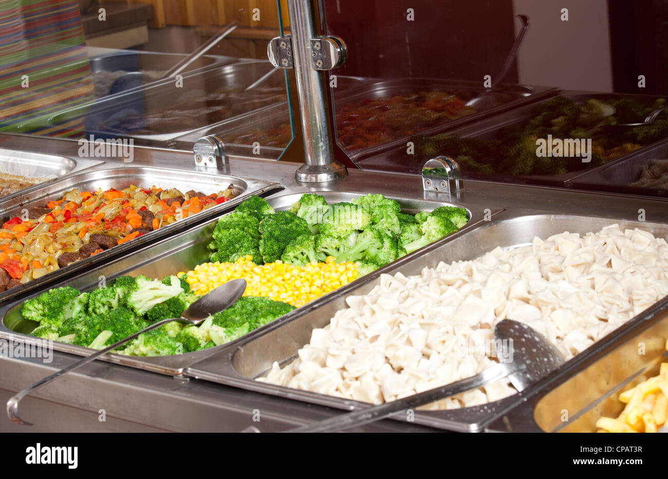 Hot trays with cooked food close-up in dining room Stock Photo - Alamy