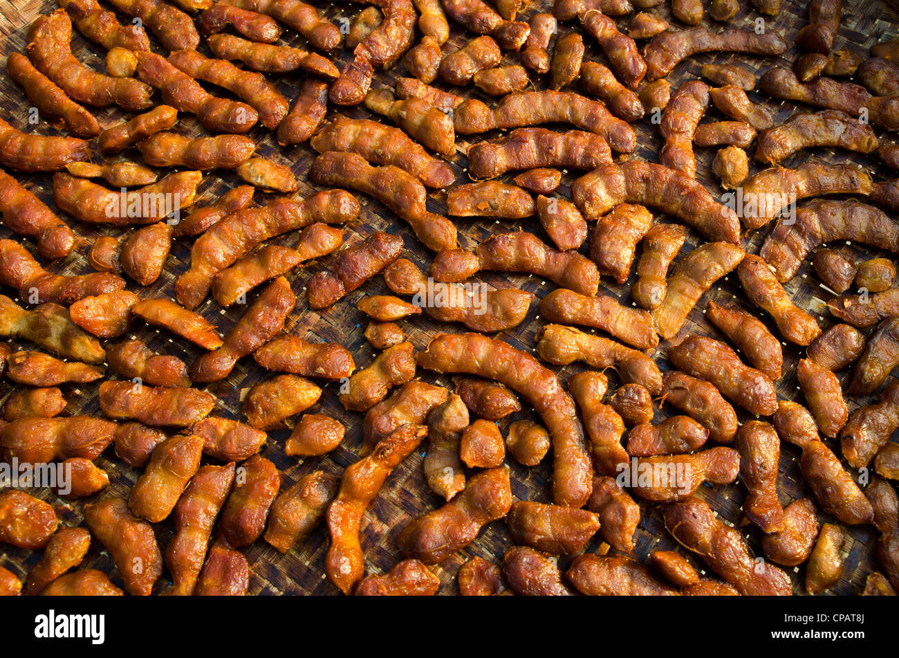 Dry tamarind on bamboo tray Stock Photo - Alamy