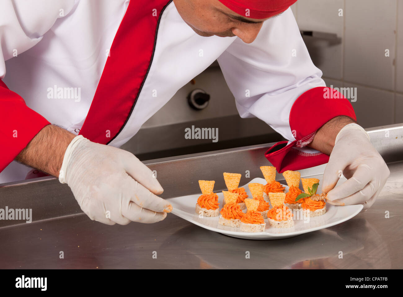chef garnishing canapes Stock Photo - Alamy